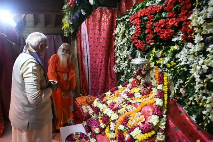 PM Modi honours Ram Janmabhoomi temple’s chief priest